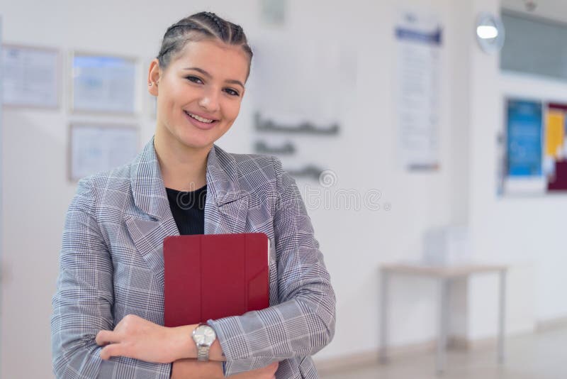 Female College Student Standing in Corridor of University after Her ...