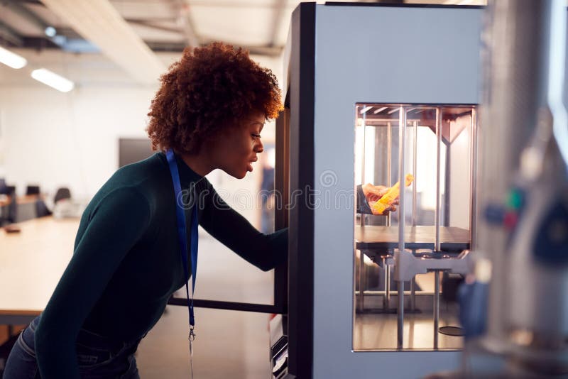 Female College Student Studying Engineering Using 3D Printing Machine ...