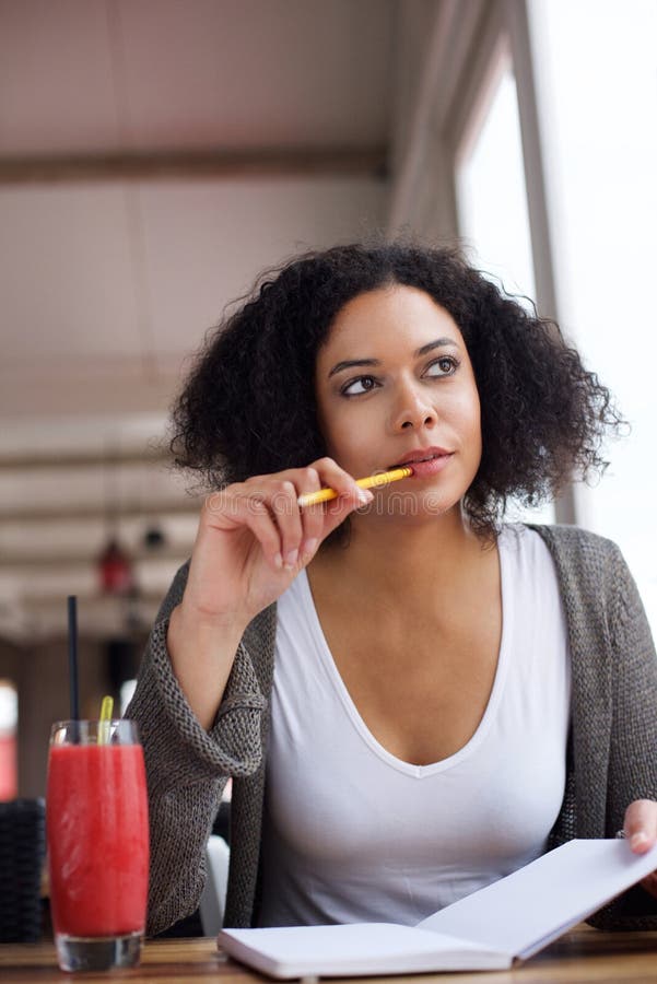 Young African American Female Student Writing in Book Stock Image ...