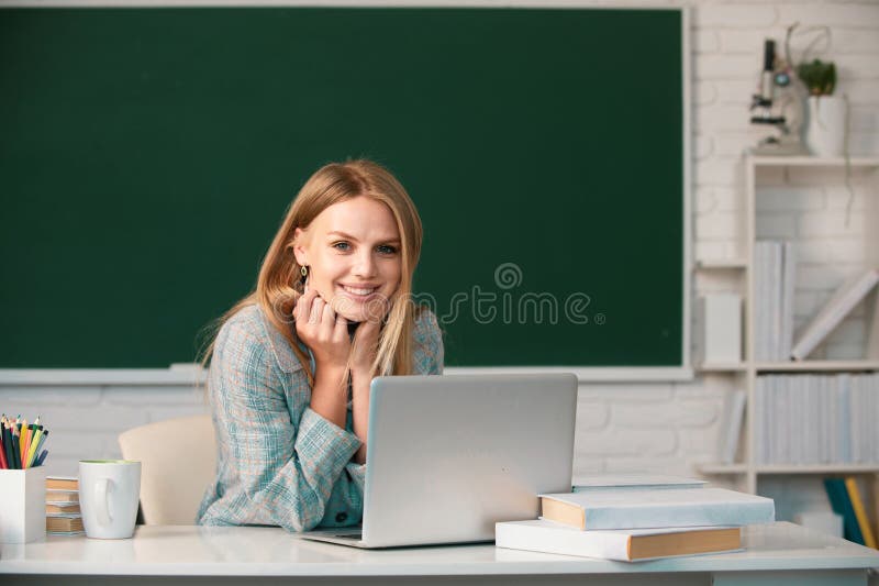 Female College Student Working on a Laptop in Classroom, Preparing for ...