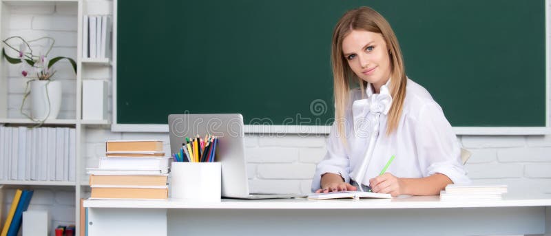 Female College Student Writing on Notebook in Classroom, Preparing for ...