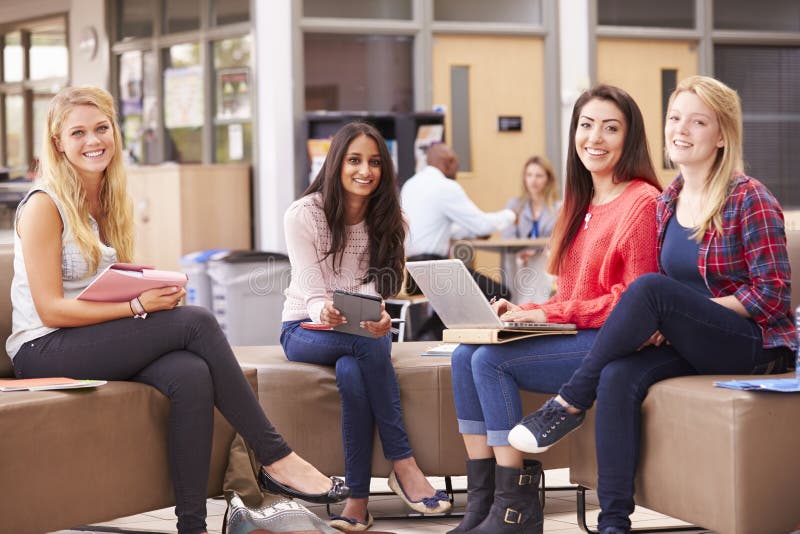 Female College Students Sitting And Talking Together Stock Photo ...