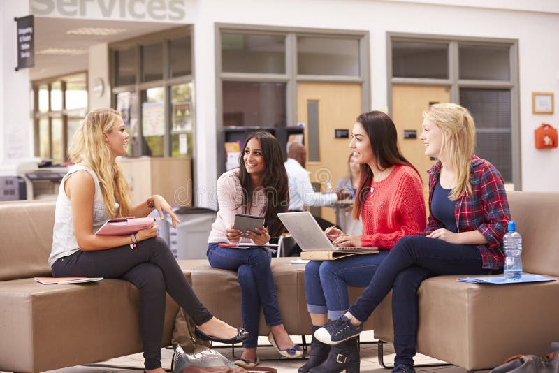 Female College Students Sitting and Talking Together Stock Photo ...