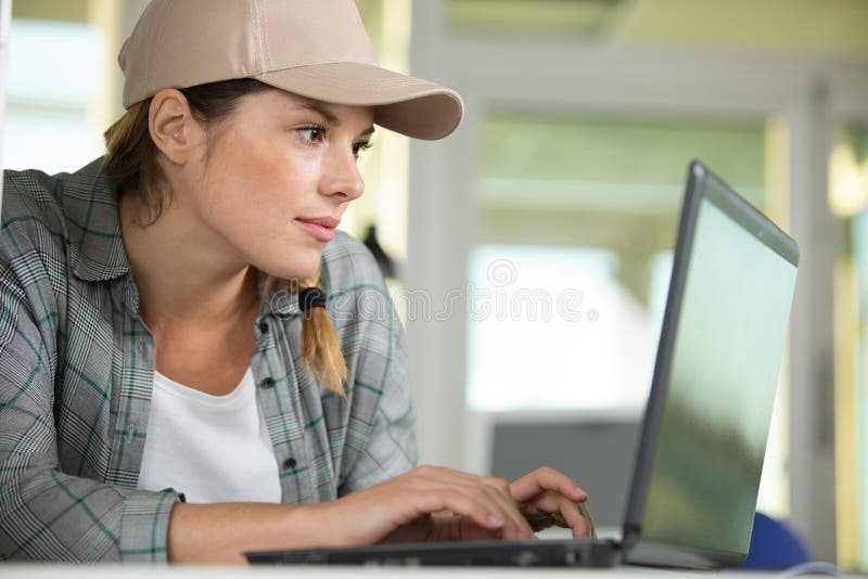 Female Computer Technician Using Laptop Stock Image - Image of working ...
