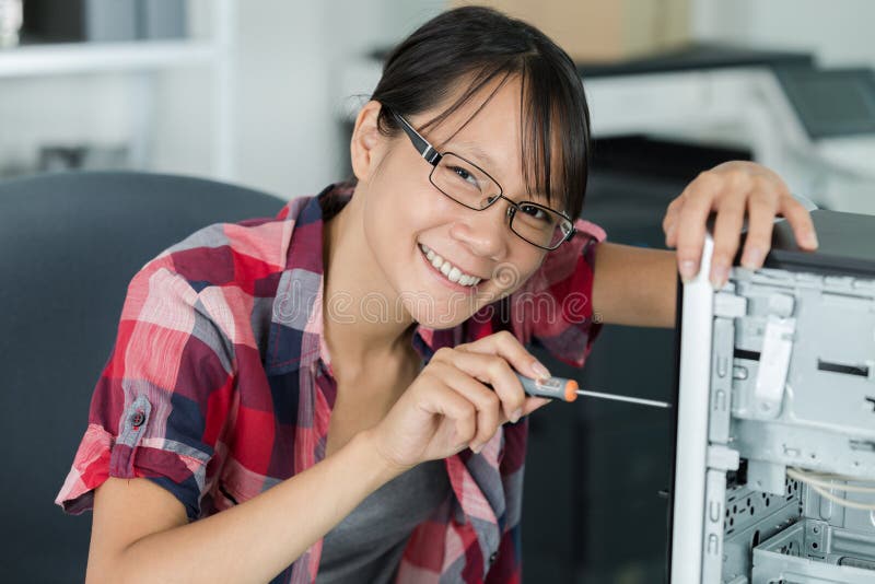Female Computer Technician Using Screwdriver Stock Image - Image of ...