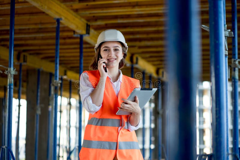 Female Construction Engineer. Architect with a Tablet Computer at a ...