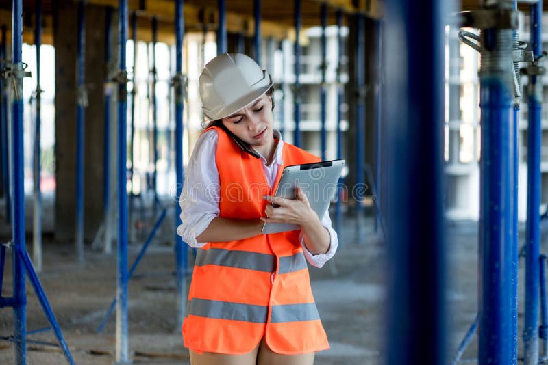 Female Construction Engineer. Architect with a Tablet Computer at a ...