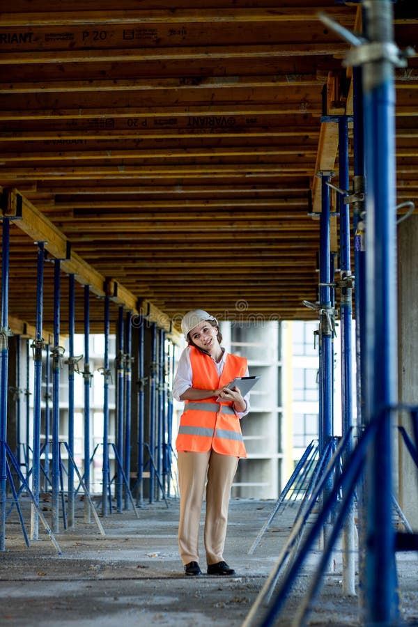 Female Construction Engineer. Architect with a Tablet Computer at a ...