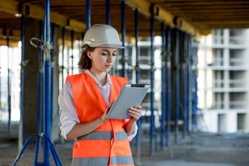Female Construction Engineer. Architect with a Tablet Computer at a ...