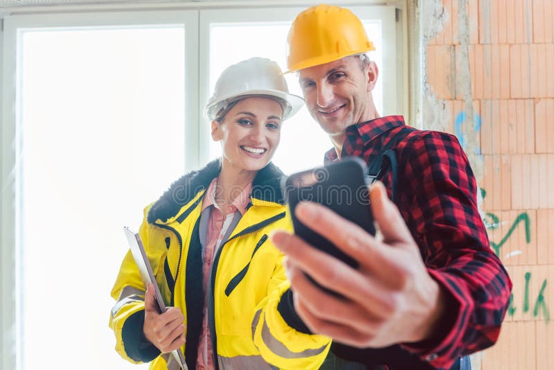 Female Construction Engineer and Male Worker Taking Selfie Stock Photo ...