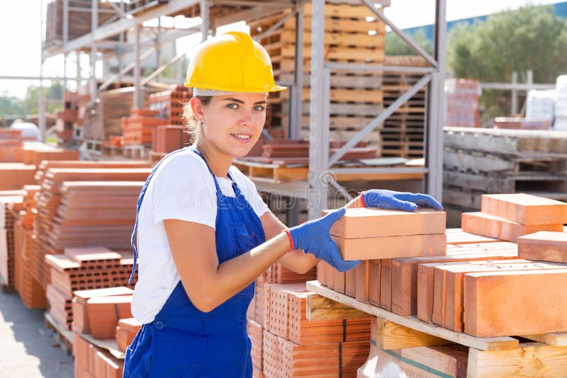 Construction Shop Worker Stacks Bricks on an Open-air Site Stock Image ...
