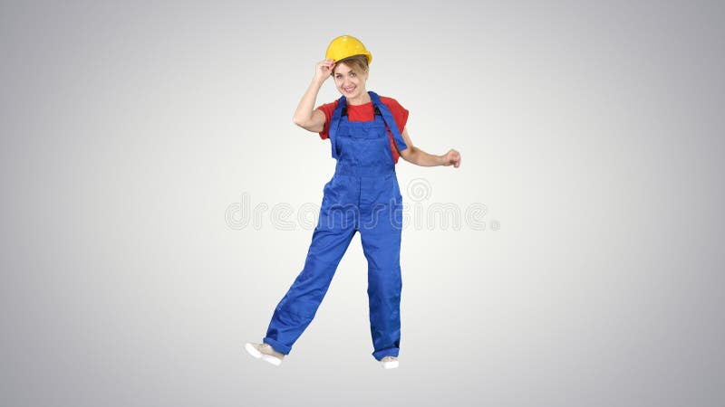 Female Construction Worker Funny Dance on Gradient Background. Stock ...