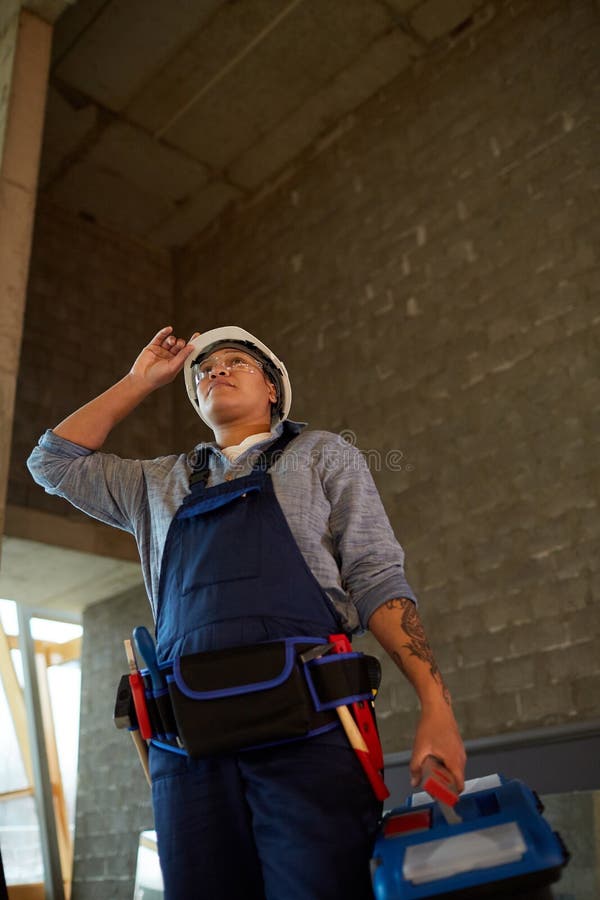 Female Construction Worker Holding Toolbox Stock Photo - Image of ...