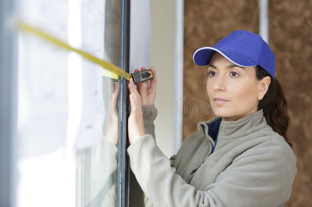 Female Construction Worker Installing New Windows Stock Photo - Image of blind, dimensions ...