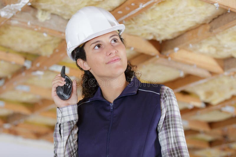 Female Construction Worker Using Walkie Talkie on Site Stock Photo ...