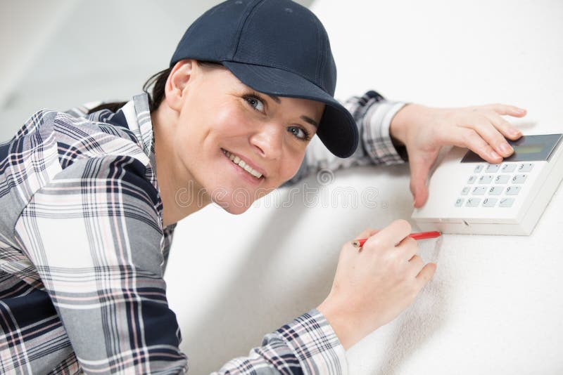 Female Contractor Installing Keypad Wall Stock Photos - Free & Royalty ...