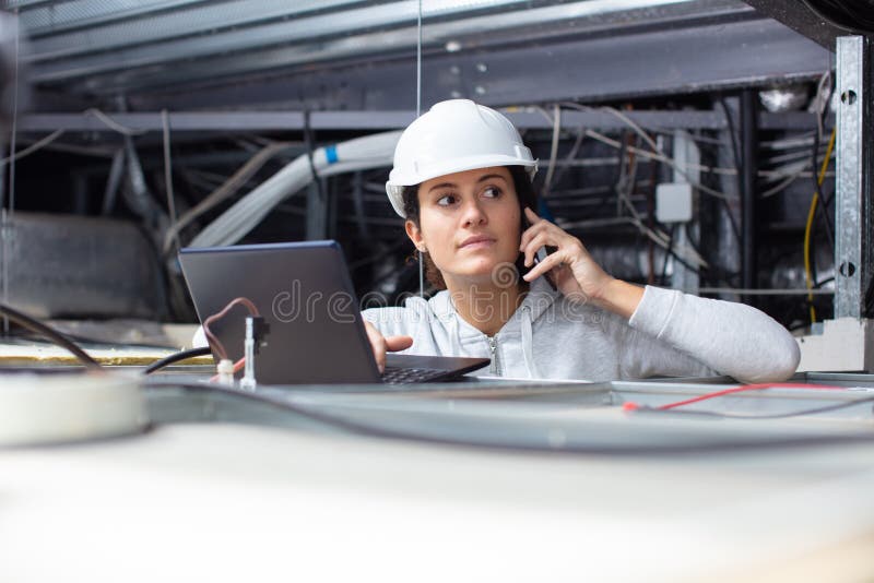 Female Contractor Using Laptop in Roofspace Stock Image - Image of ...