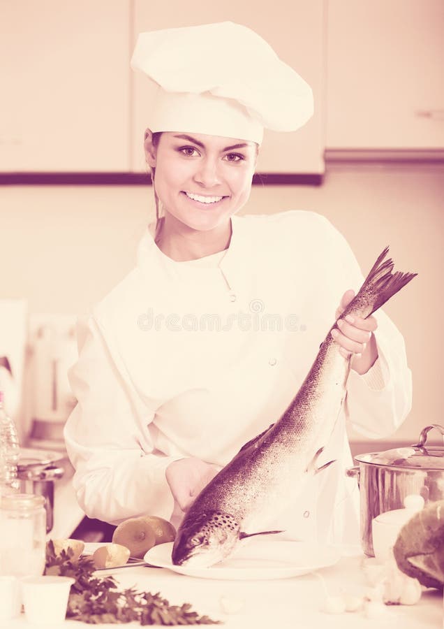 Female Cook Preparing Big Fish Stock Photo - Image of professional ...