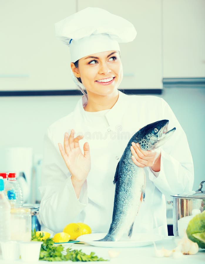 Female Cook Preparing Big Fish Stock Photo - Image of american ...