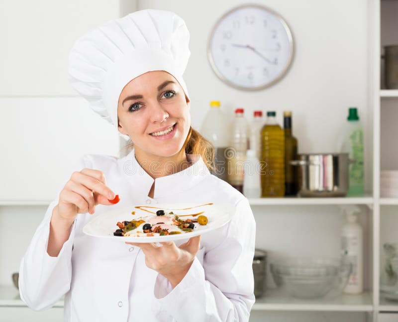 Female cook preparing food stock image. Image of profession - 210261673