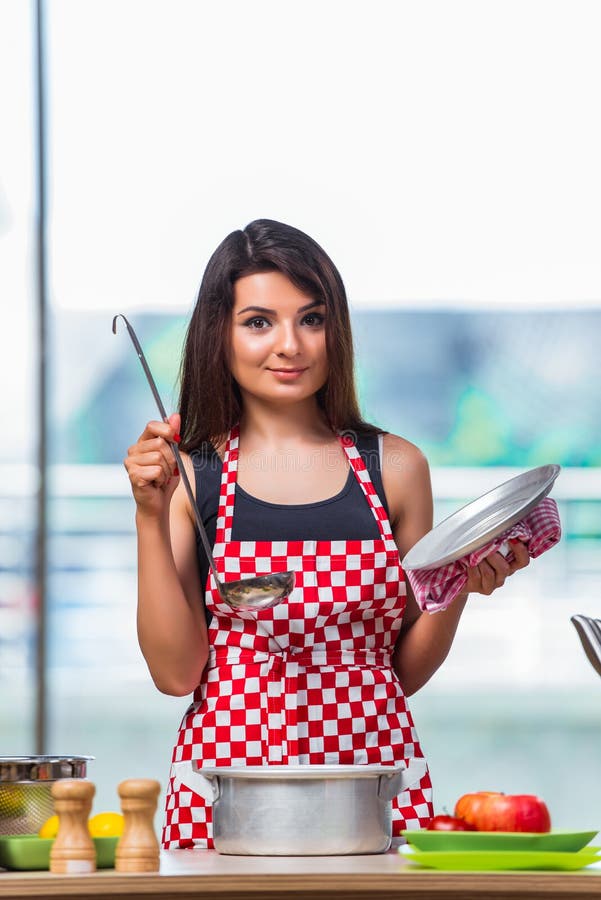 The Female Cook Preparing Soup in Brightly Lit Kitchen Stock Photo ...