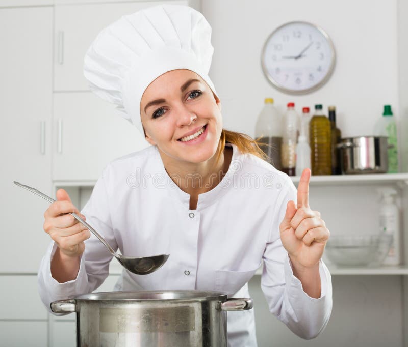 Female cook tasting food stock photo. Image of european - 95169880