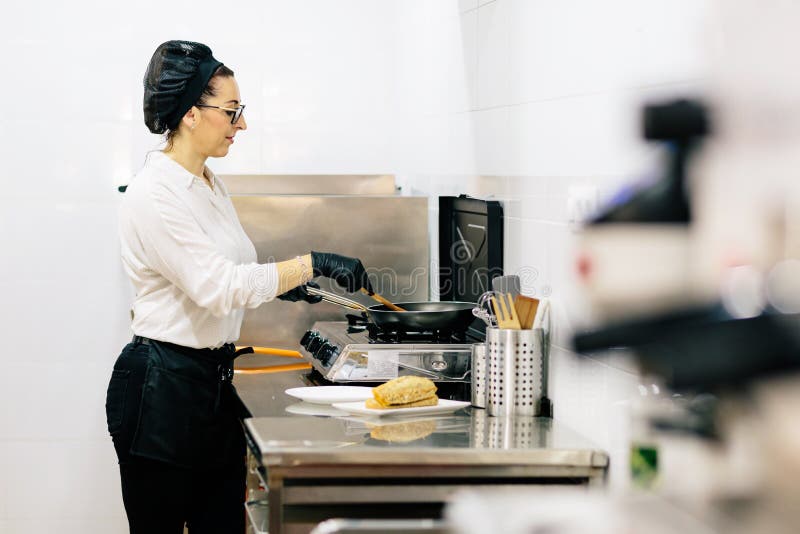 Female Cook Working in a Restaurant Kitchen. Small Business of ...