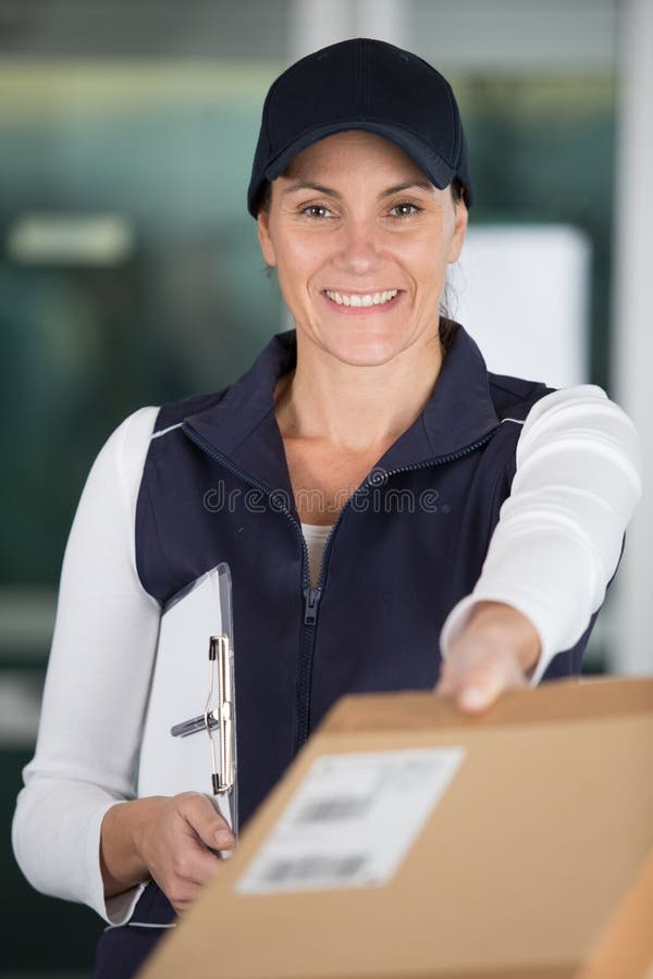 Female Courrier Holds Forward Parcel Stock Image - Image of shipping ...