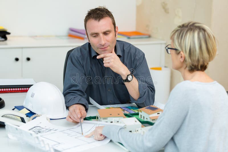 Female Customer and Architect on Construction Site Stock Photo - Image ...