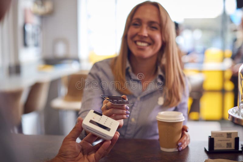 Female Customer Making Contactless Payment in Coffee Shop Using Debit ...
