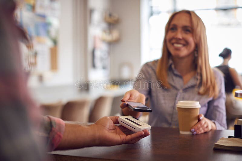 Female Customer Making Contactless Payment in Coffee Shop Using Mobile ...