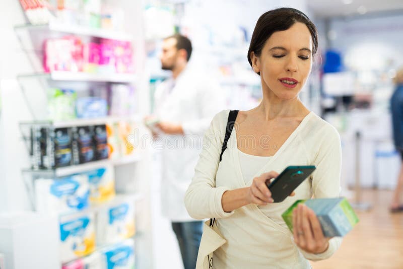 Female Customer Scans Barcode on a Medicine Box Using Phone Stock Photo ...