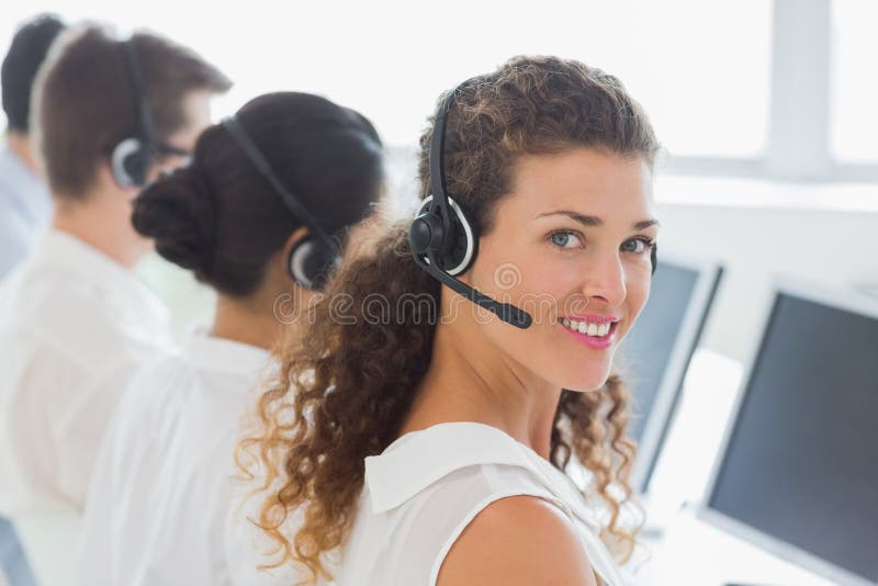 Female Customer Service Agent with Colleagues Stock Photo - Image of ...