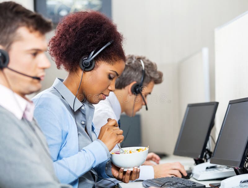 Female Customer Service Representative Having Food Stock Photo - Image ...