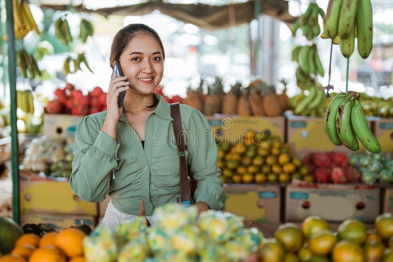 Female Customer Smiling while Calling on Phone Stock Image - Image of ...