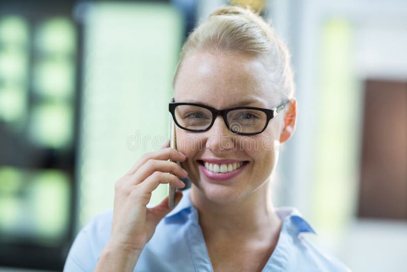 Female Customer Talking on Mobile Phone Stock Image - Image of ...