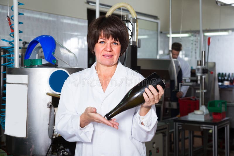 Female Demonstrating Wine Bottle Stock Image - Image of professional ...