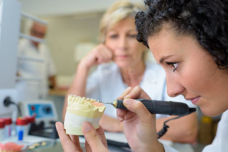 Female Dental Technician Working with Implant Mold Stock Photo - Image ...
