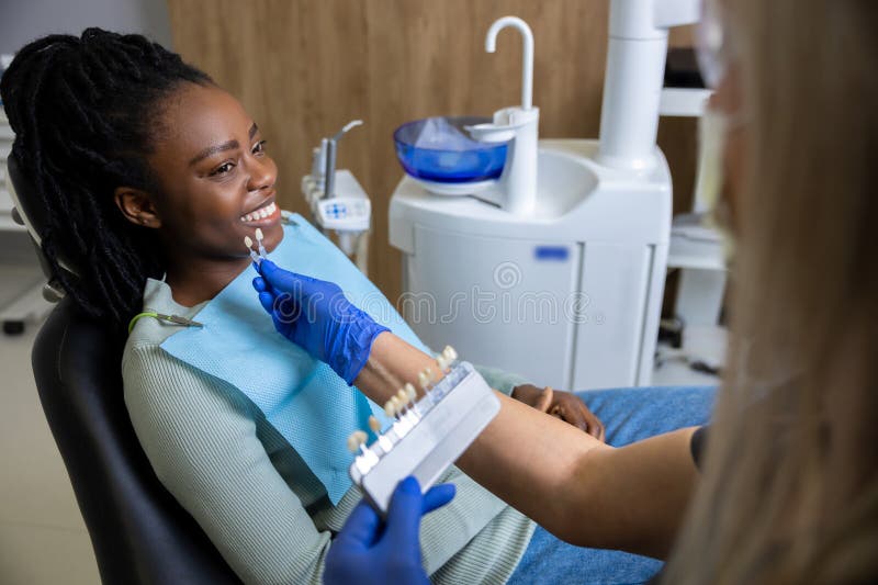 Female Dentist Choosing Right Color for Patient Stock Photo - Image of ... Female Dentist Choosing Right Color for Patient Stock Photo - Image of ...
