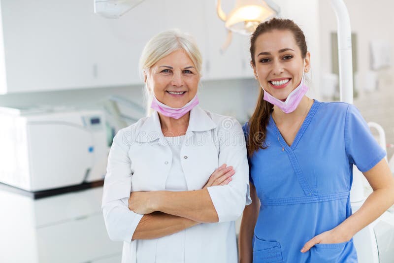 Female Dentist and Dental Assistant in Office Stock Photo - Image of ...