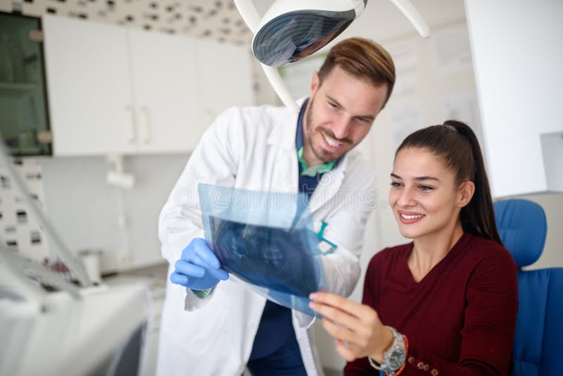 Female with Dentist Looking Her Teeth on X-ray Stock Image - Image of ...