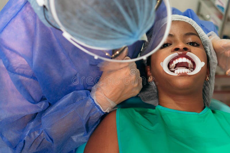 Female Dentist Treating Patient In A Dental Office Stock Image Image