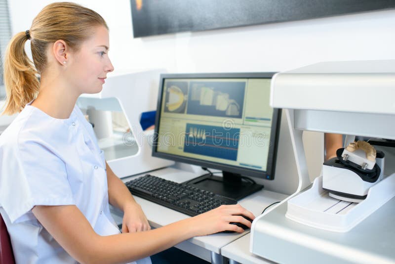 Female Dentist Using Computer Stock Image - Image of help, dental: 83781057