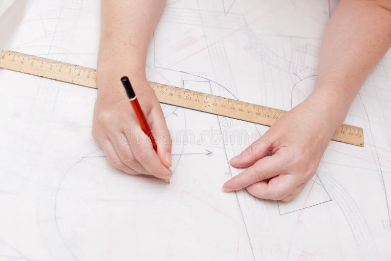 Female Designer Drawing Flat Paper Patterns. Exclusive Clothes Making ...