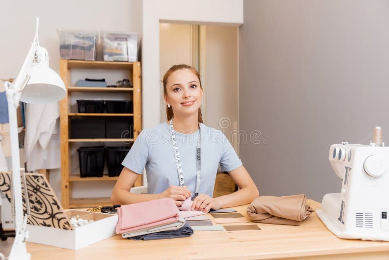 Female Designer Dressmaker Working on Sewing Machine in Studio Stock ...