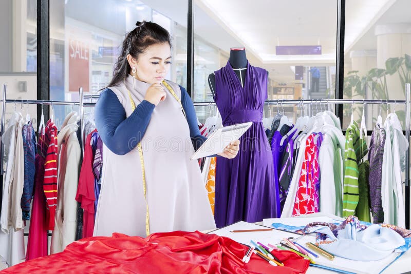 Female Designer Taking Photo Of Her New Dress Stock Photo - Image of ...