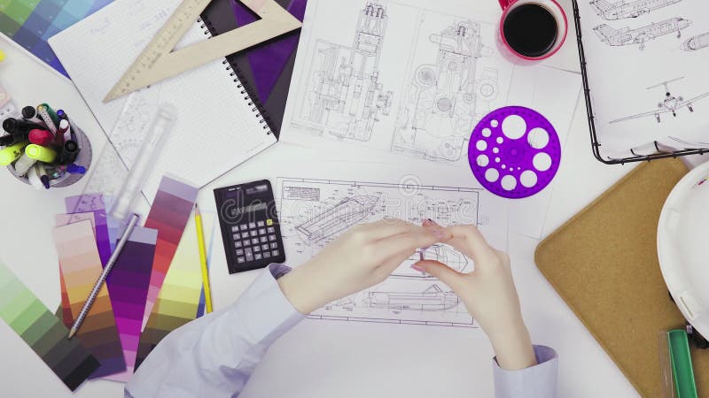 Top View of a Female Designer Drawing Drawings on a Ruler Working in a ...