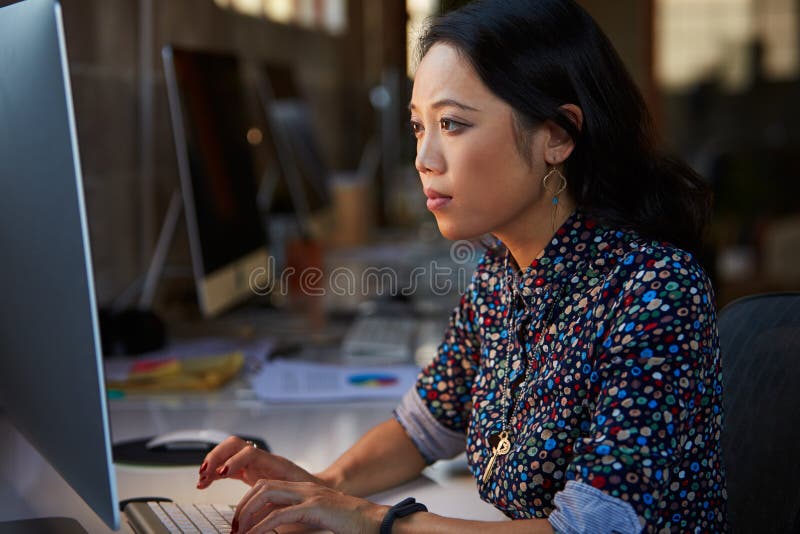 Female Designer Working At Desk In Modern Office - Stock Image - Everypixel
