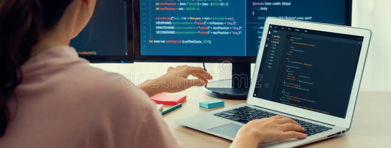 Female Developer Coding on Laptop while Computer Display Program ...