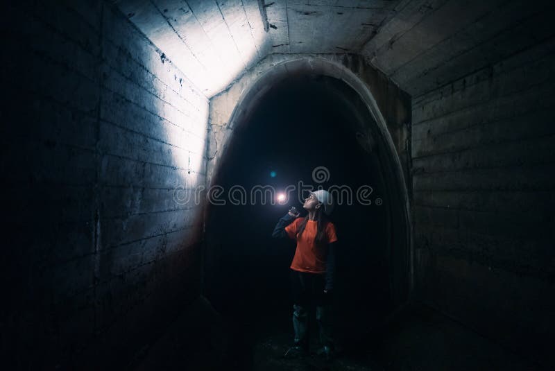 Female Digger with Flashlight Explores the Tunnel Stock Image - Image ...